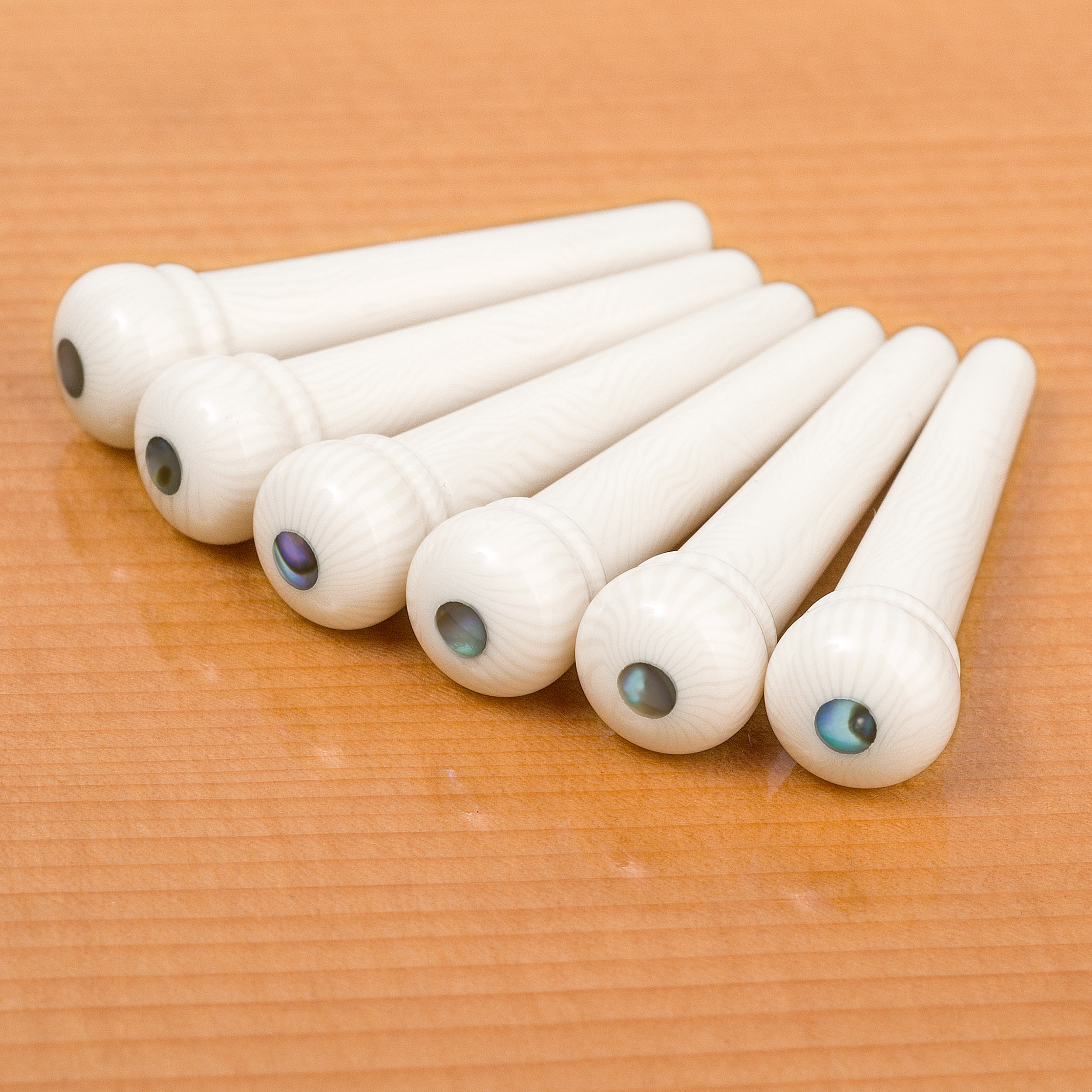 Waverly Ivoroid Bridge Pins with Abalone Inlay - StewMac