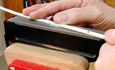 Installing side dots with the help of plywood scraps - StewMac