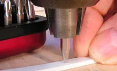 Installing side dots with the help of plywood scraps - StewMac