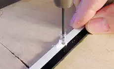 Installing side dots with the help of plywood scraps - StewMac