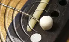 Custom-fit your bridge pins for better sound - StewMac