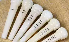 Custom-fit your bridge pins for better sound - StewMac