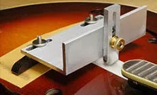 Fitting an archtop bridge, easily and accurately - StewMac