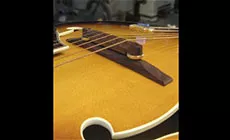 Fitting an archtop bridge, easily and accurately - StewMac