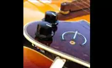 Fitting an archtop bridge, easily and accurately - StewMac
