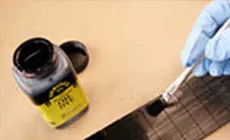 For ebony streaks, use black fingerboard stain - StewMac