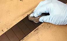 For ebony streaks, use black fingerboard stain - StewMac