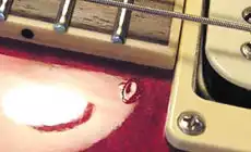 Lacquer drop fill: hiding a scratch on a customer's Les Paul - StewMac
