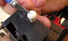 Making new bridge pins look old on a vintage Gibson - StewMac
