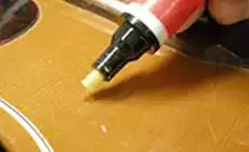 Whoops! How to hide a scratch in your big brother's guitar - StewMac