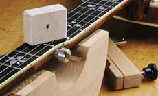Setting up a banjo's 5th string: nut, capos and peg - StewMac