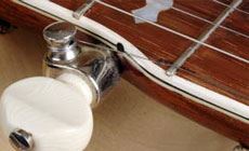 Setting up a banjo's 5th string: nut, capos and peg - StewMac