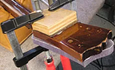 Hiding an "evil smile" peghead break with the Razor Blade Trick - StewMac