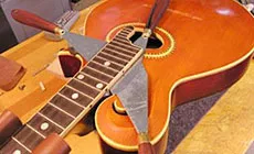 Straightening the neck on a 1914 Gibson mandolin - StewMac