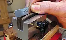 When frets don't fit the slot, resize the fret tang - StewMac