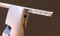 When frets don't fit the slot, resize the fret tang - StewMac